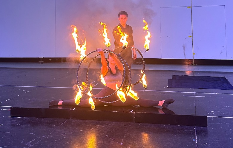 Most fire hoops spun while in splits position | Guinness World Records