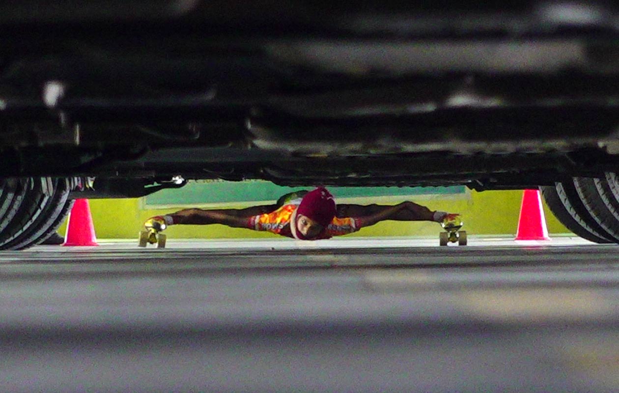 Fastest time to limbo skate under twenty cars | Guinness World Records