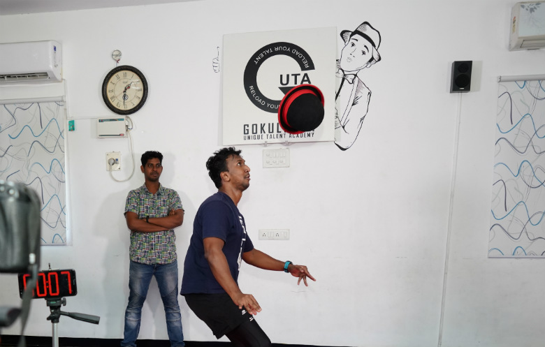 Most hat flicks from foot to head in one minute | Guinness World Records