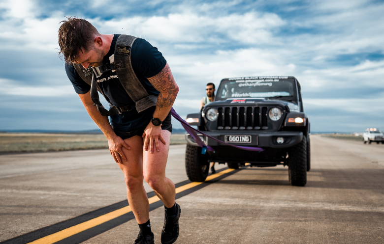 Fastest 100 km pulling a road vehicle by an individual | Guinness World ...