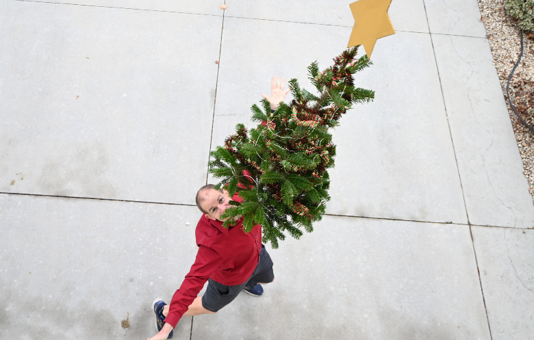 Longest time to balance a Christmas tree on the chin | Guinness World ...