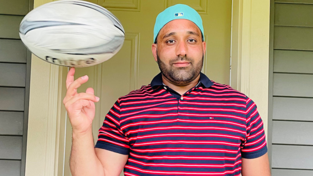 Longest time to spin a rugby ball on one finger | Guinness World Records
