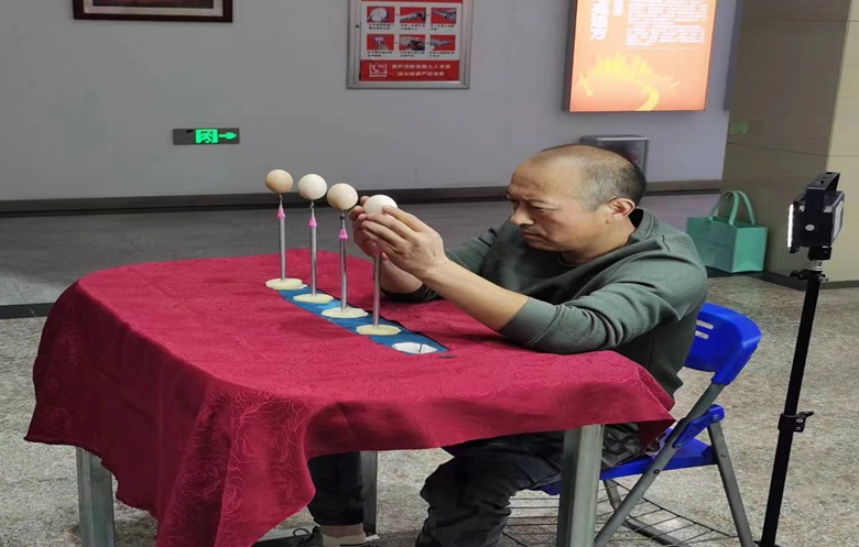 Most eggs balanced on needles in one minute | Guinness World Records