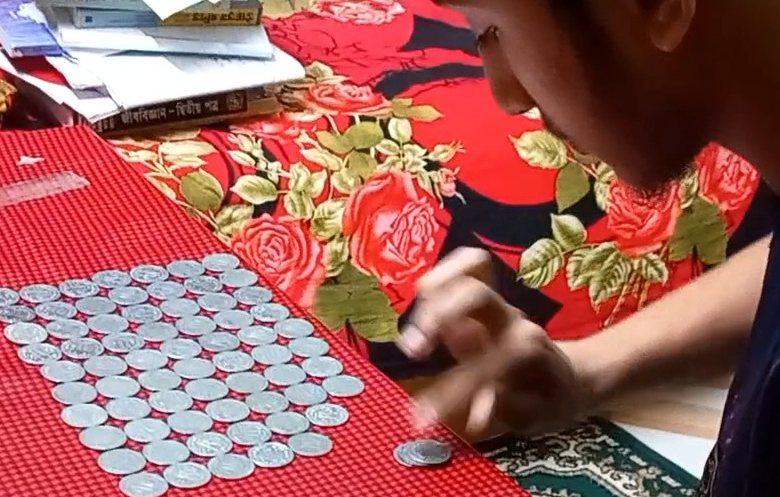 Most coins stacked into a tower in 30 seconds | Guinness World Records